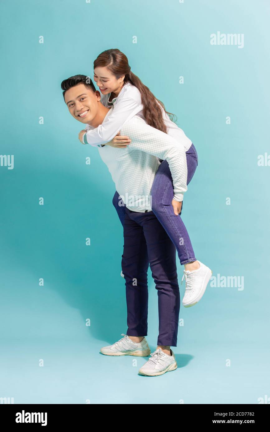 Asian man carrying girlfriend piggyback hi-res stock photography and ...