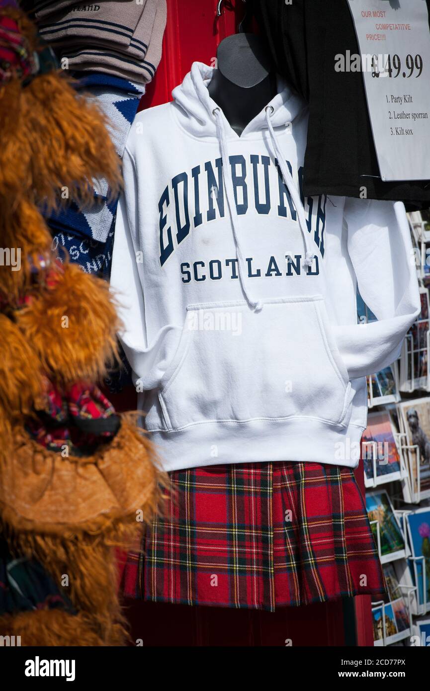 Sweatshirt and tartan kilts for sale at a gift shop in the City of ...