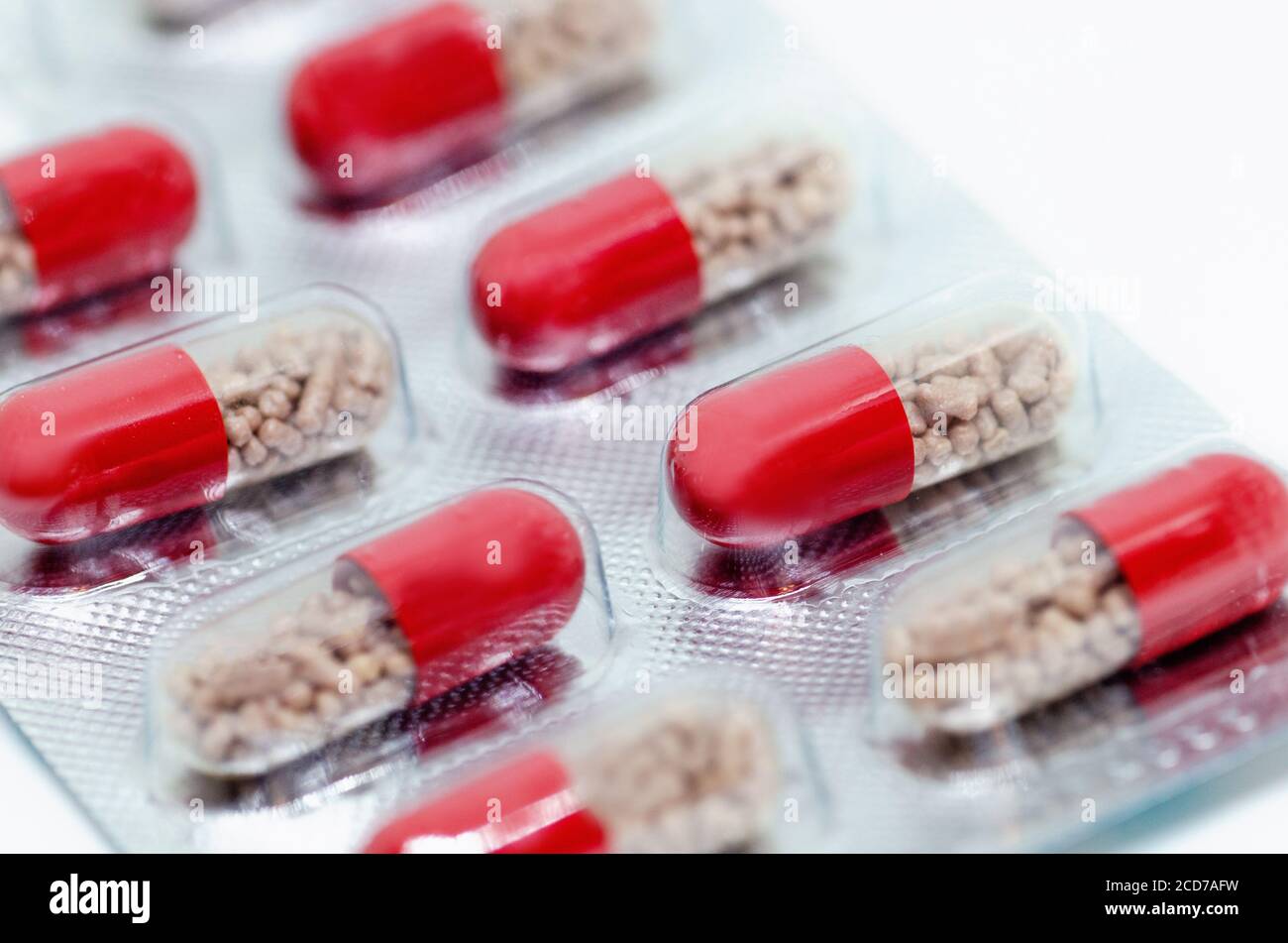 Enzyme capsules isolated on white background Stock Photo - Alamy