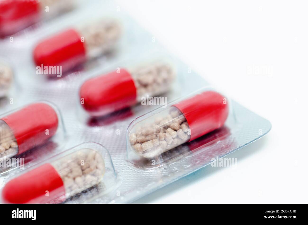 Enzyme capsules isolated on white background Stock Photo - Alamy