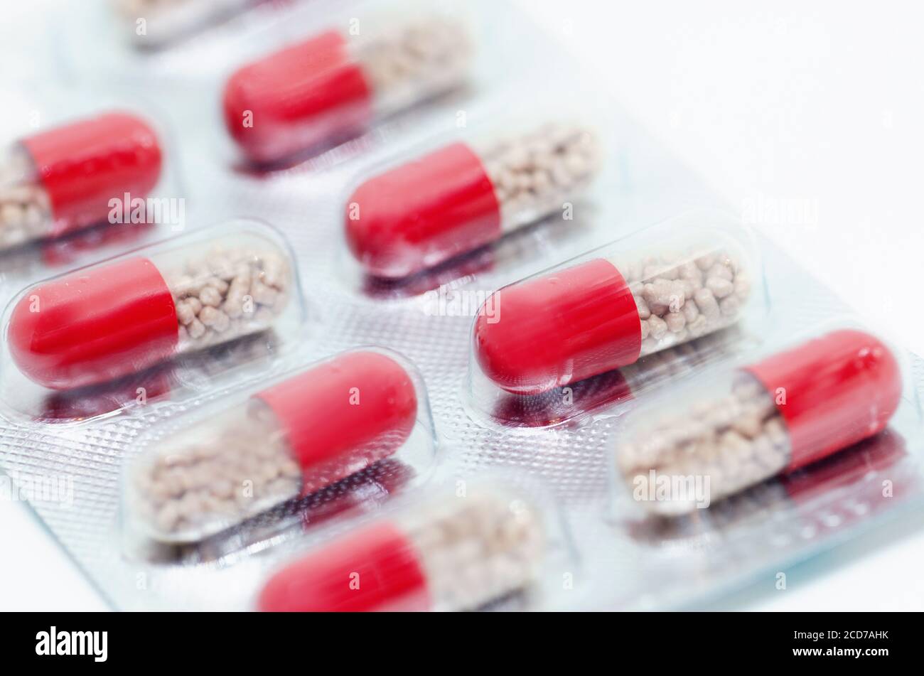 Enzyme capsules isolated on white background Stock Photo - Alamy