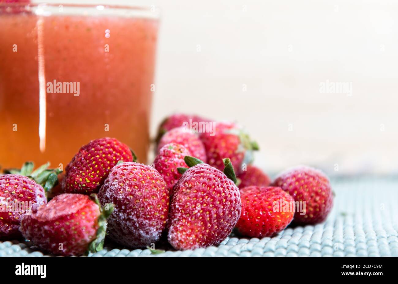 Glass of strawberry juice. White background. Refreshing drink. Frozen ...