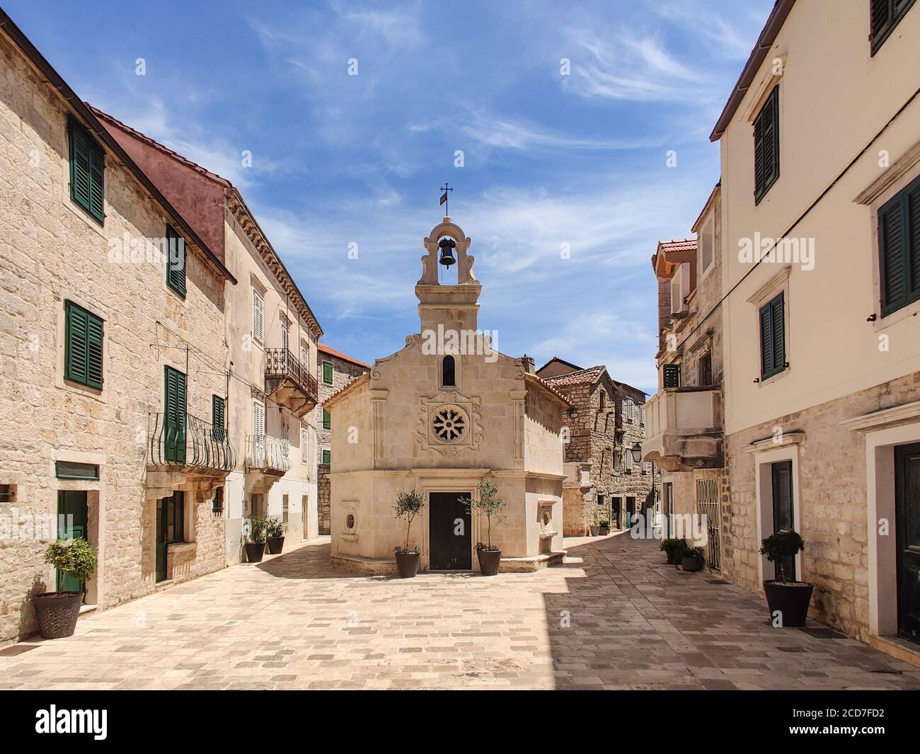 Small church on square of small urban village of Stari grad on Hvar ...