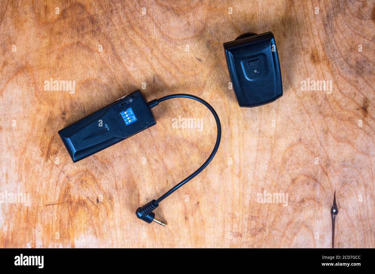 Studio flash transmitter and receiver on table Stock Photo - Alamy