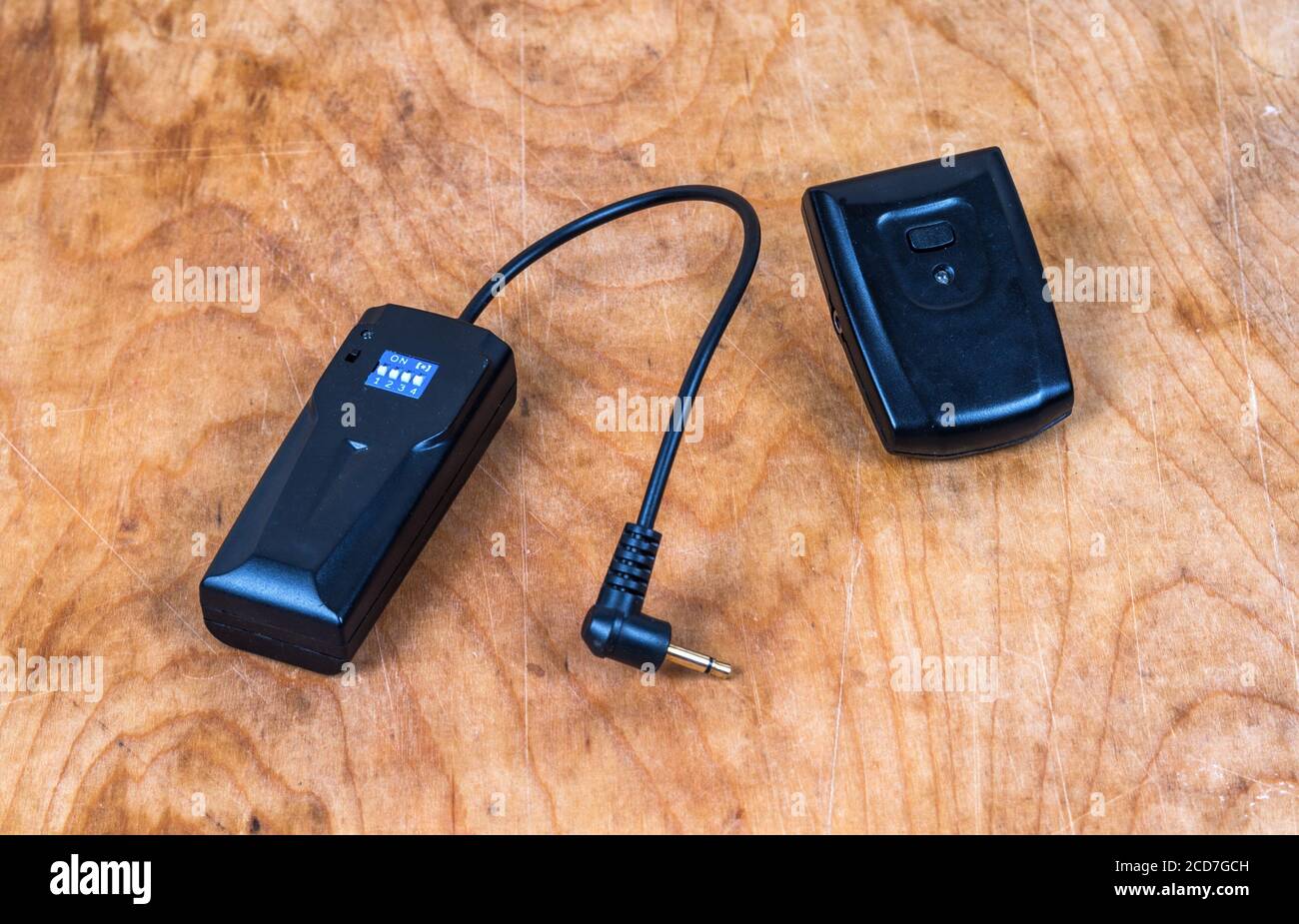 Studio flash transmitter and receiver on table Stock Photo - Alamy