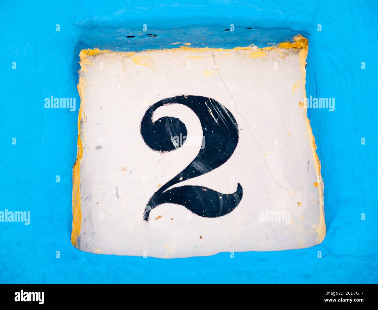 Closeup shot of number two on the wall Stock Photo - Alamy