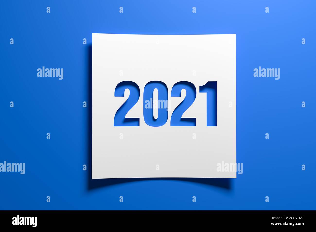 A piece of curved memo paper with the cut out number 2021 on blue ...