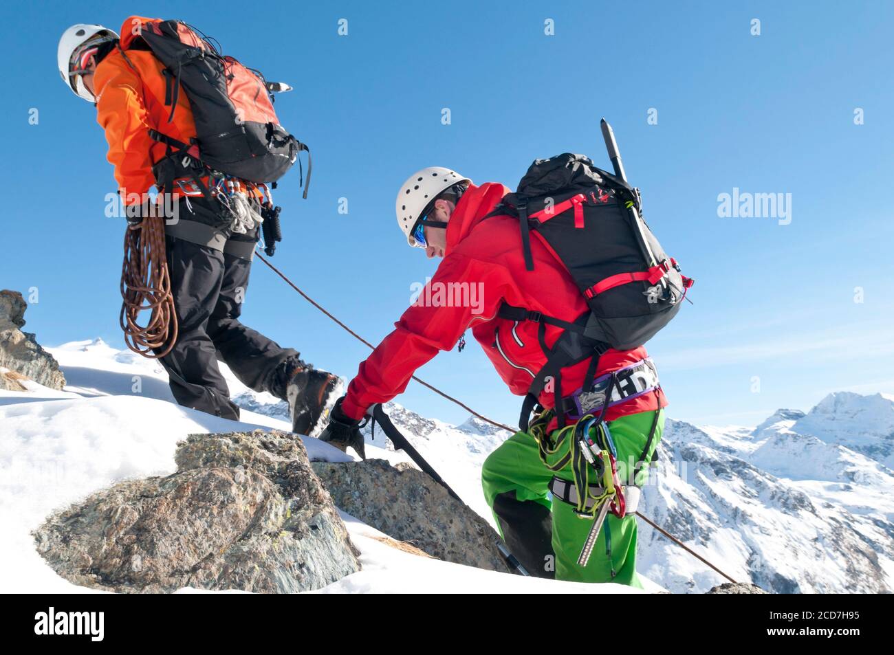 Rope team ascending to mountain top in high alpine region of Monte Rosa ...