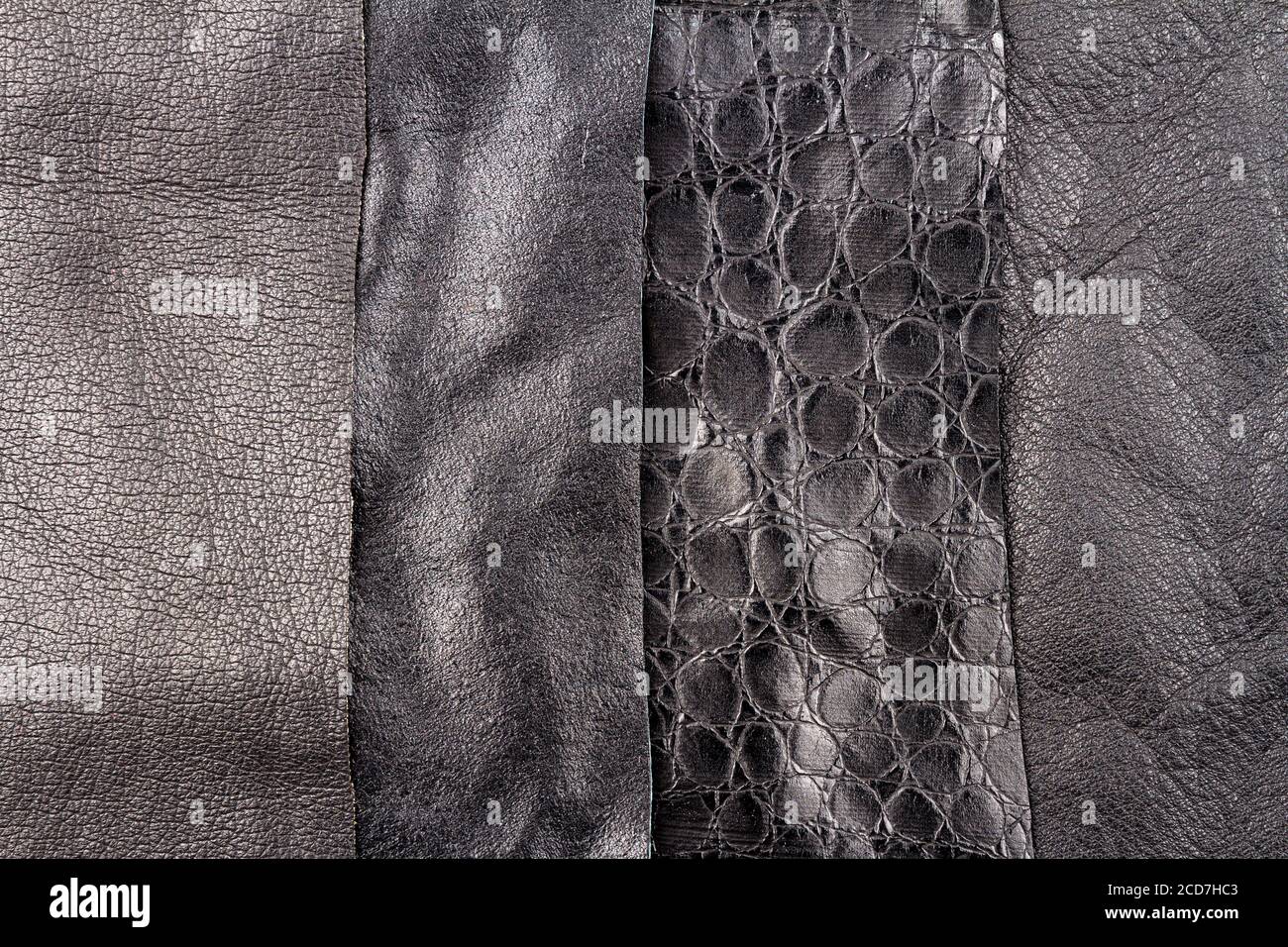 Black leather and fake artificial alligator skin textures background ...