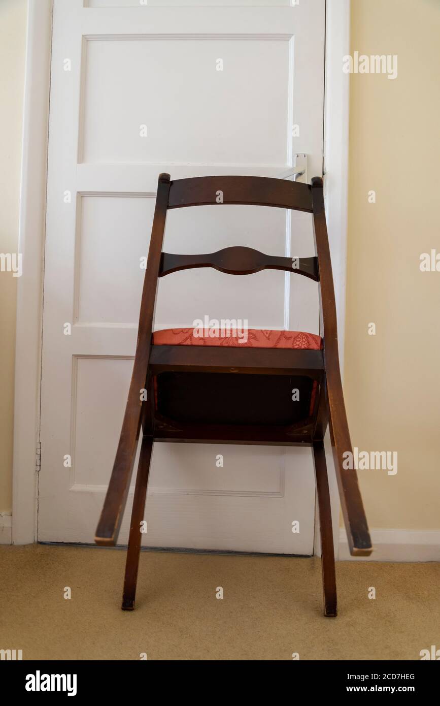 Dining chair Holding a Door Shut in a bedroom in a suburban house ...