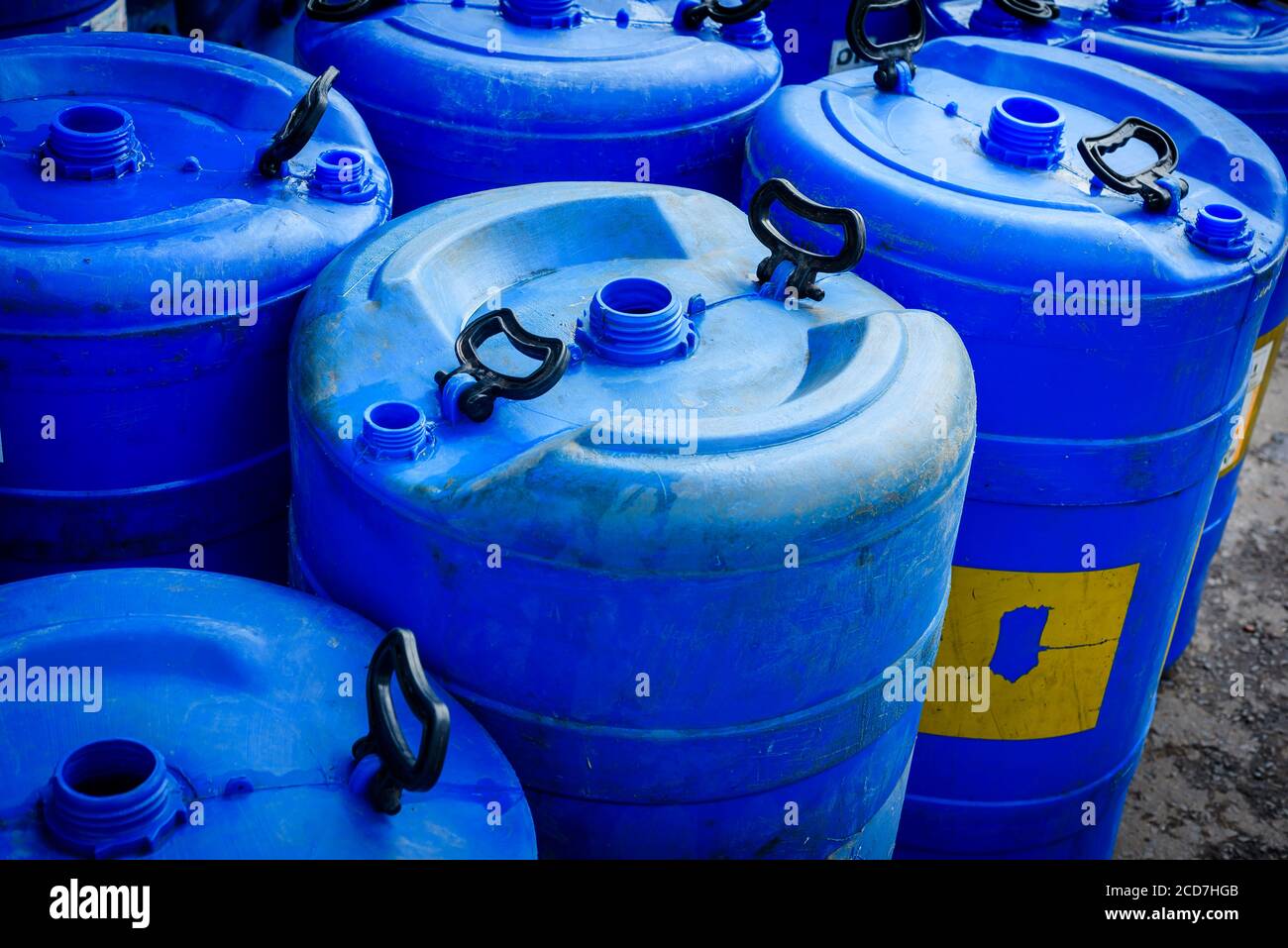 Blue water tank kept in roadside Stock Photo - Alamy