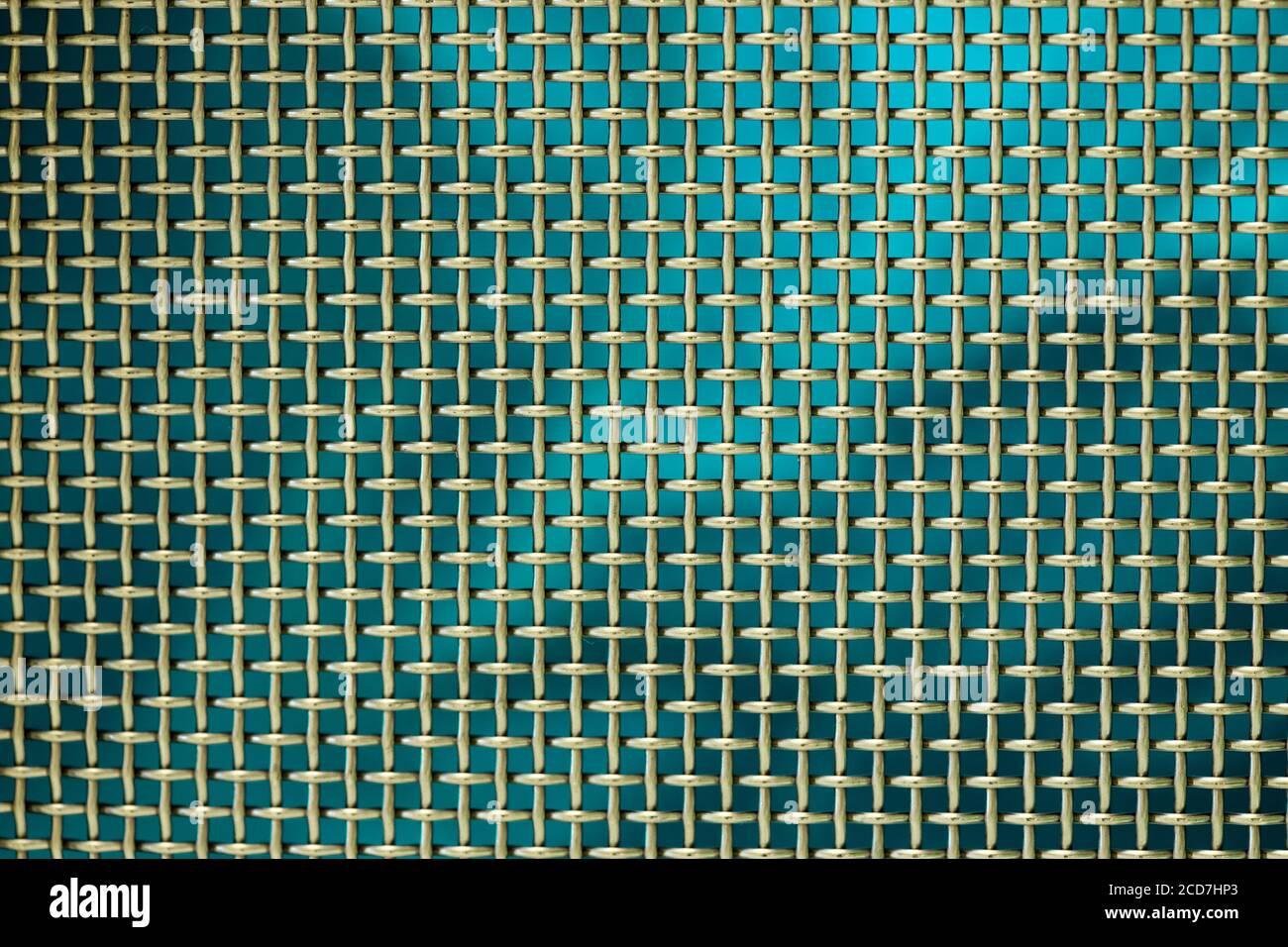 Woven wire mesh with blue background Stock Photo - Alamy