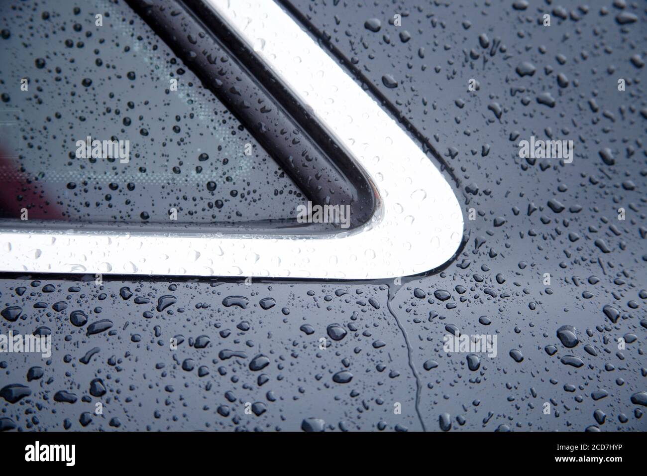 Water drops collect on top of metallic car surface Stock Photo - Alamy