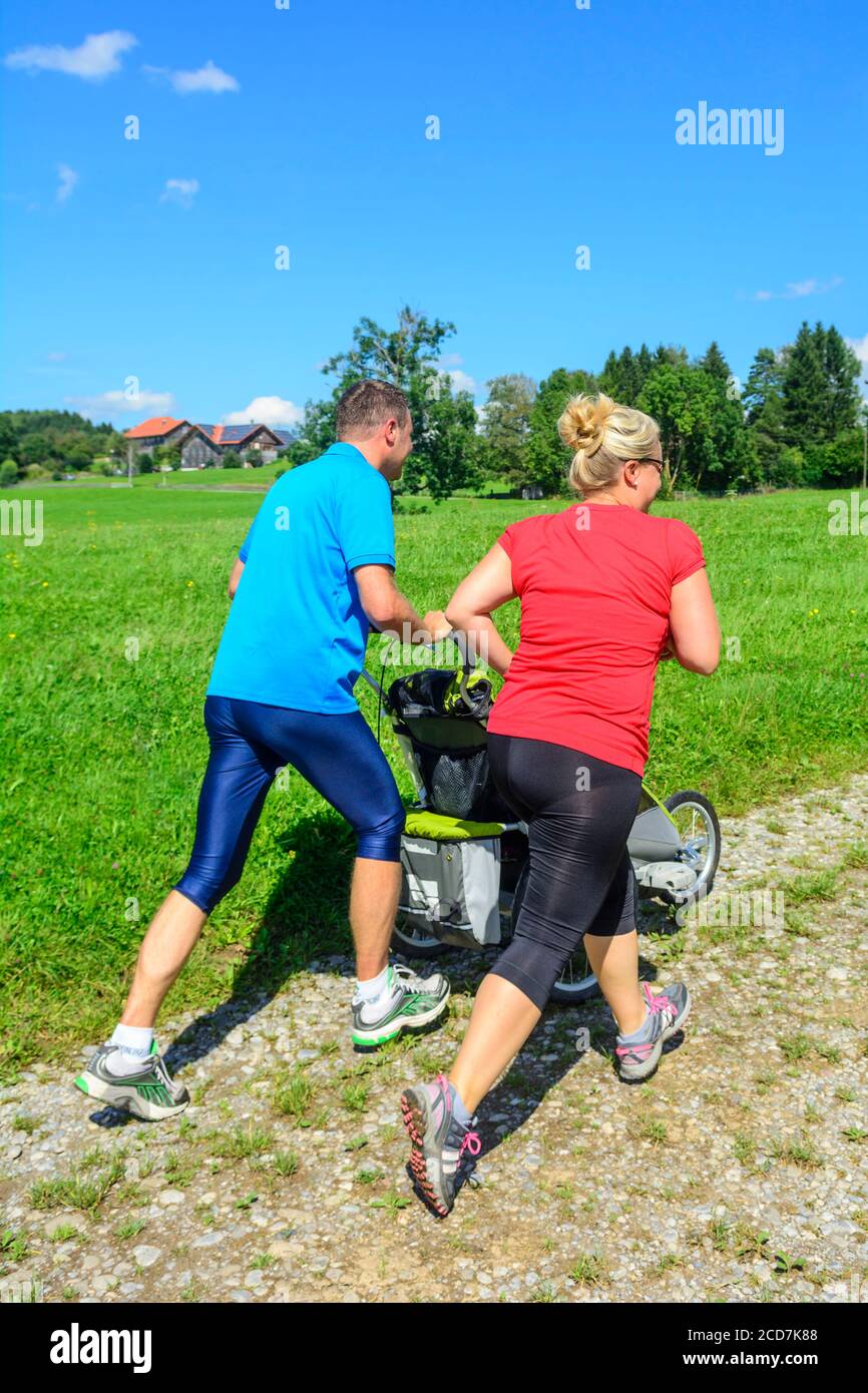 Sporty family doing a jogging session in beautiful landscape Stock ...