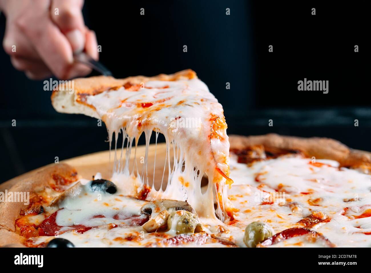 Hot pizza slice melting cheese hi-res stock photography and images - Alamy