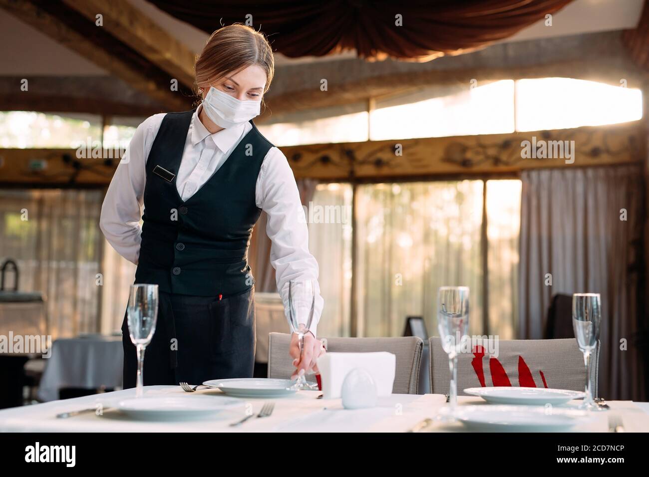 Table setting restaurant waiter mask hi-res stock photography and ...