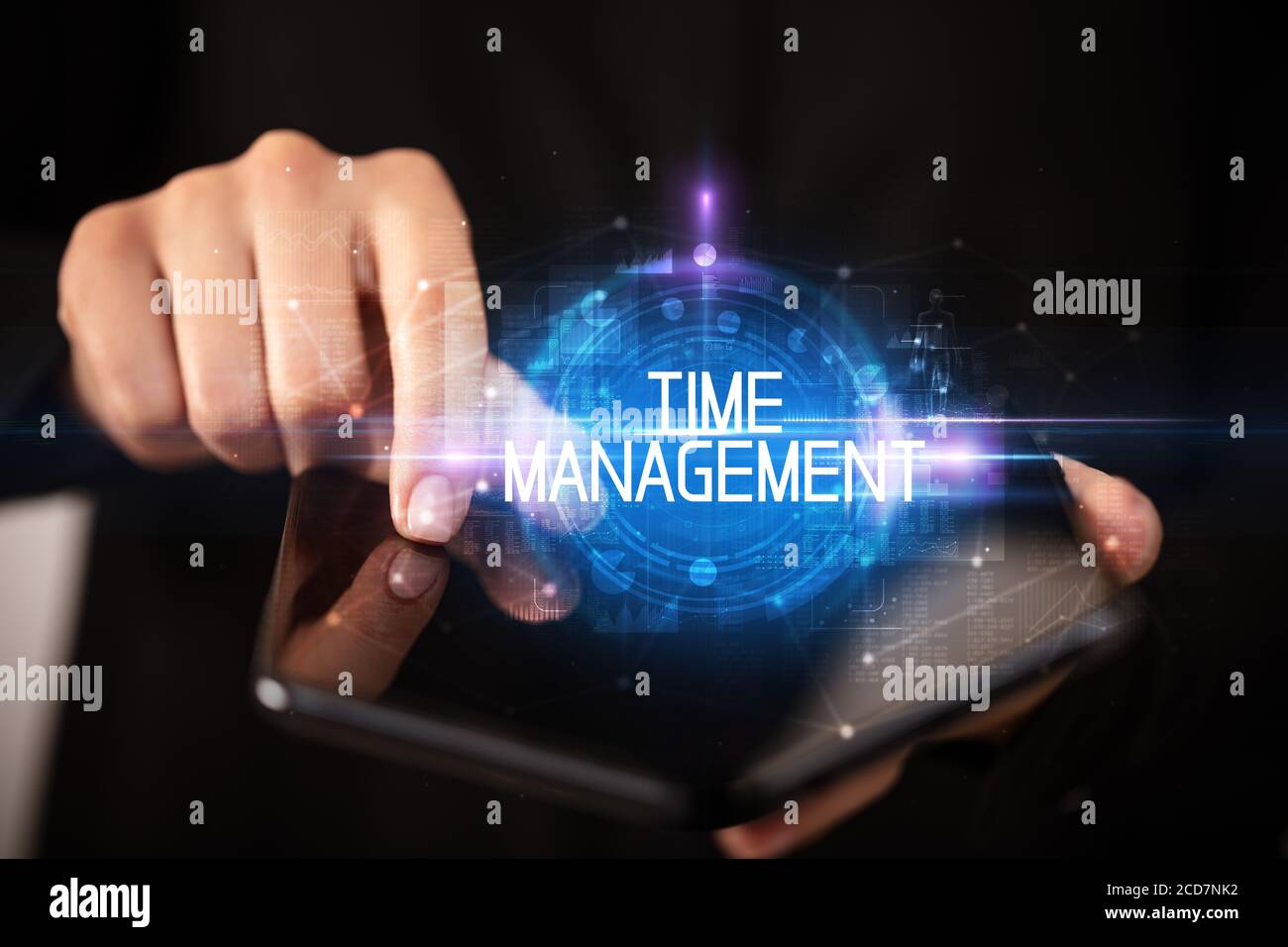 Young man holding a foldable smartphone with TIME MANAGEMENT ...