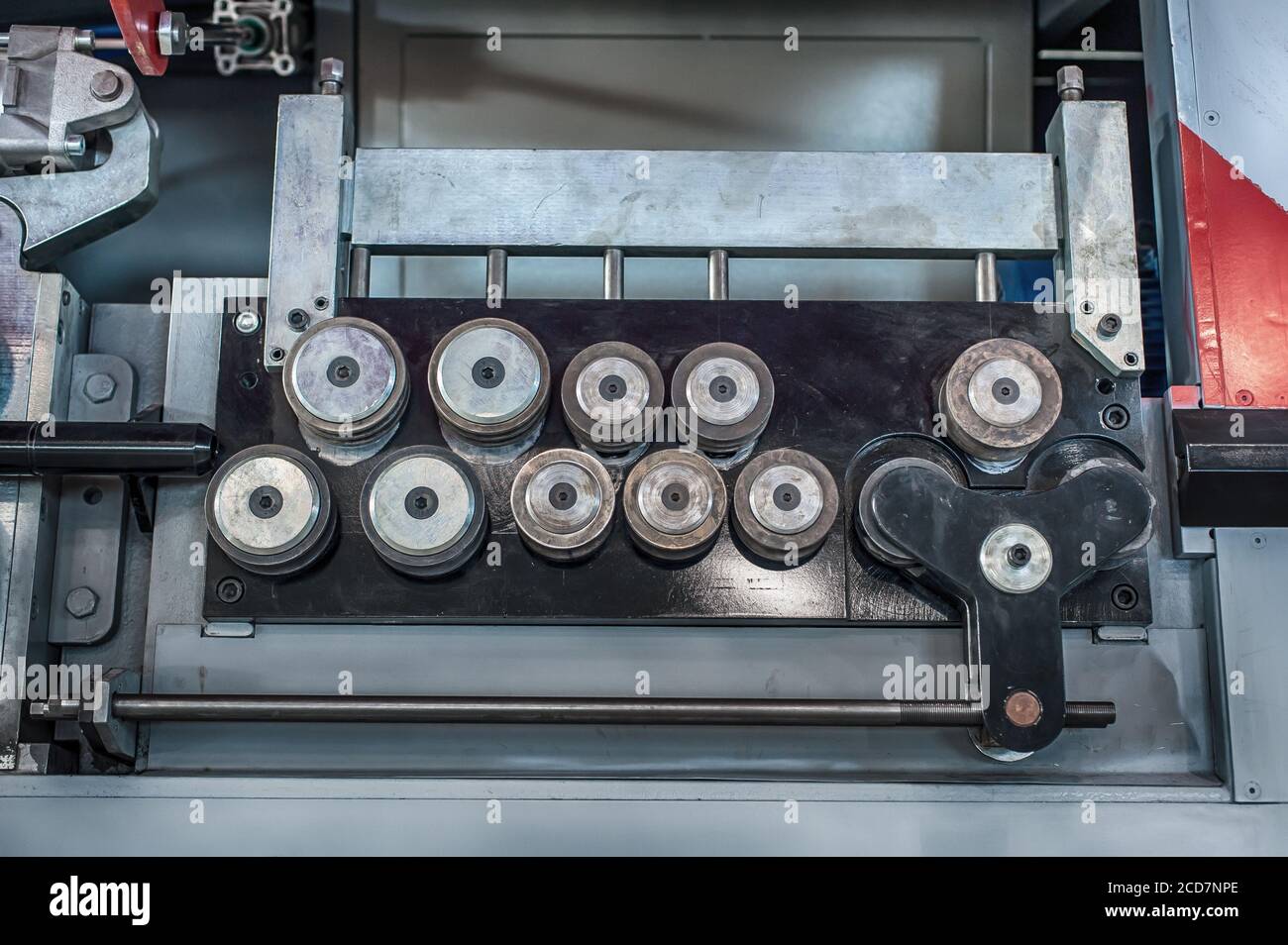 Close up detail view of mechanical nut transport system in industrial ...