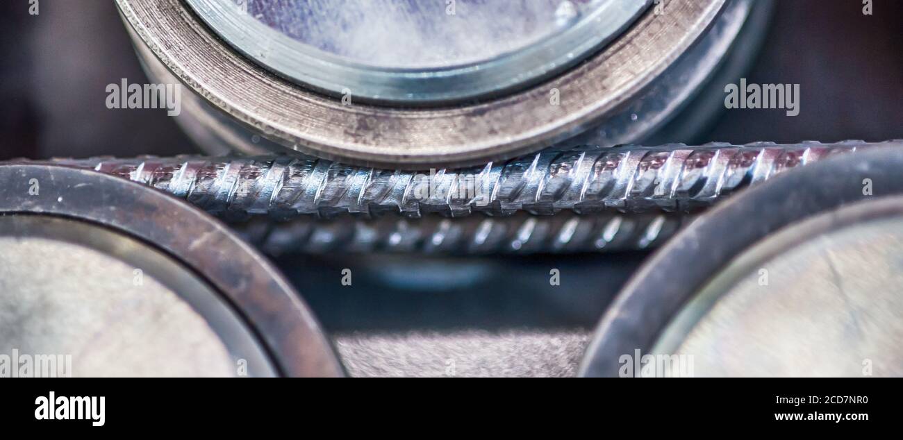 Close up detail view of mechanical nut transport system in industrial ...