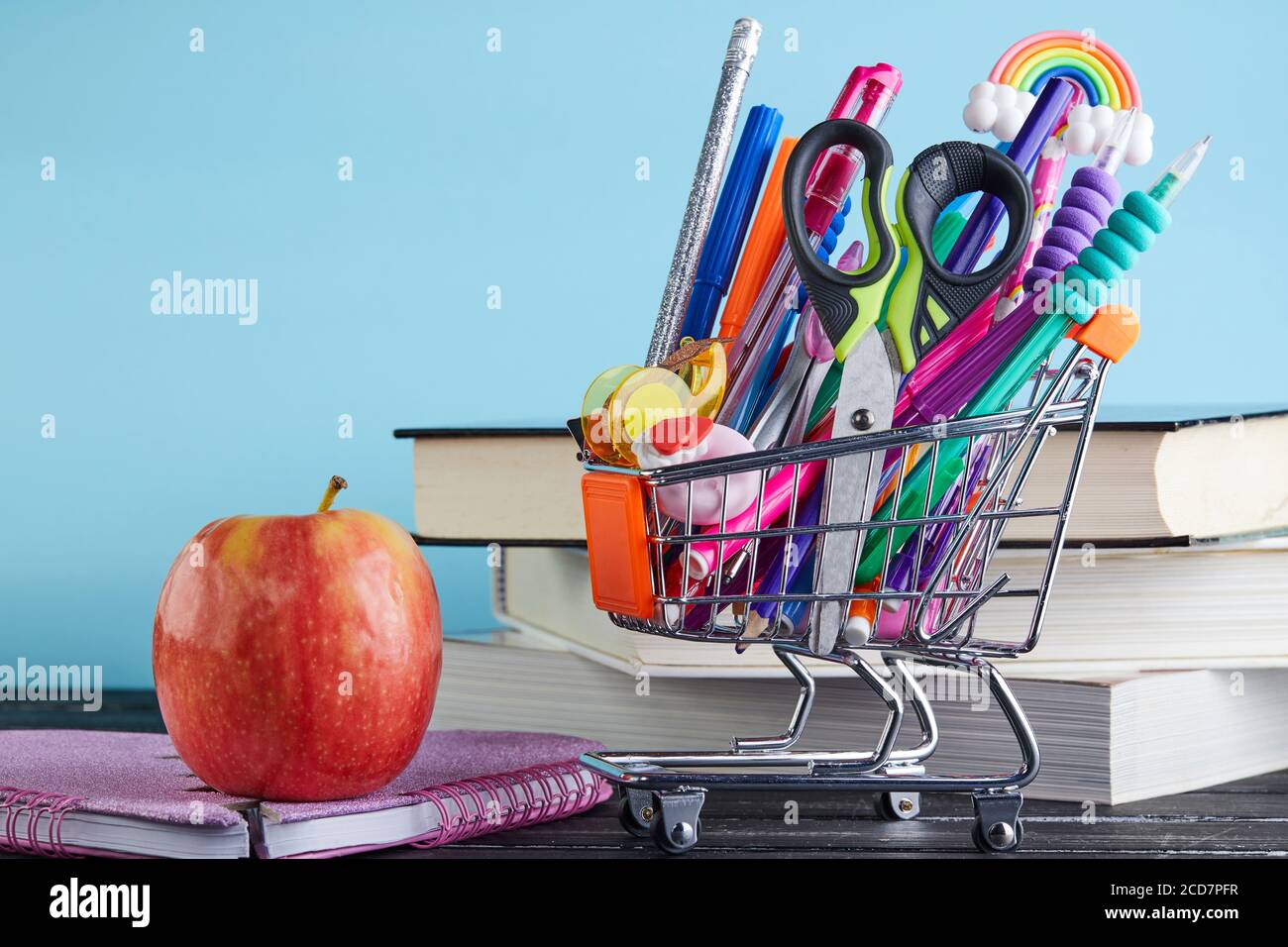 Banner of Shopping cart with school supply on a blue background with a ...