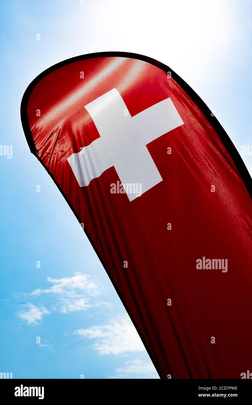 Swiss Banner Flag Against Blue Sky and Sunlight in Switzerland Stock ...