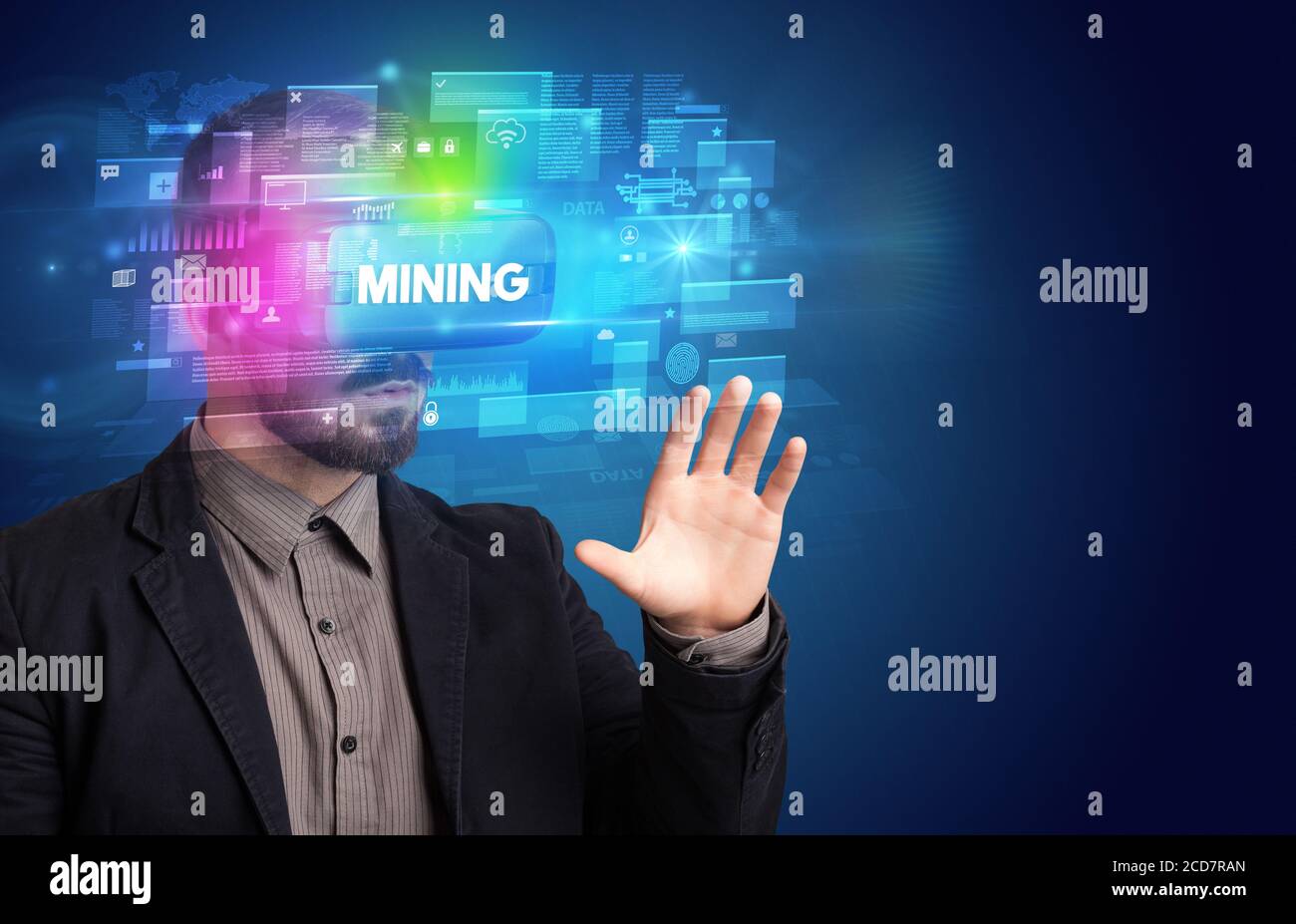 Businessman looking through Virtual Reality glasses with MINING ...