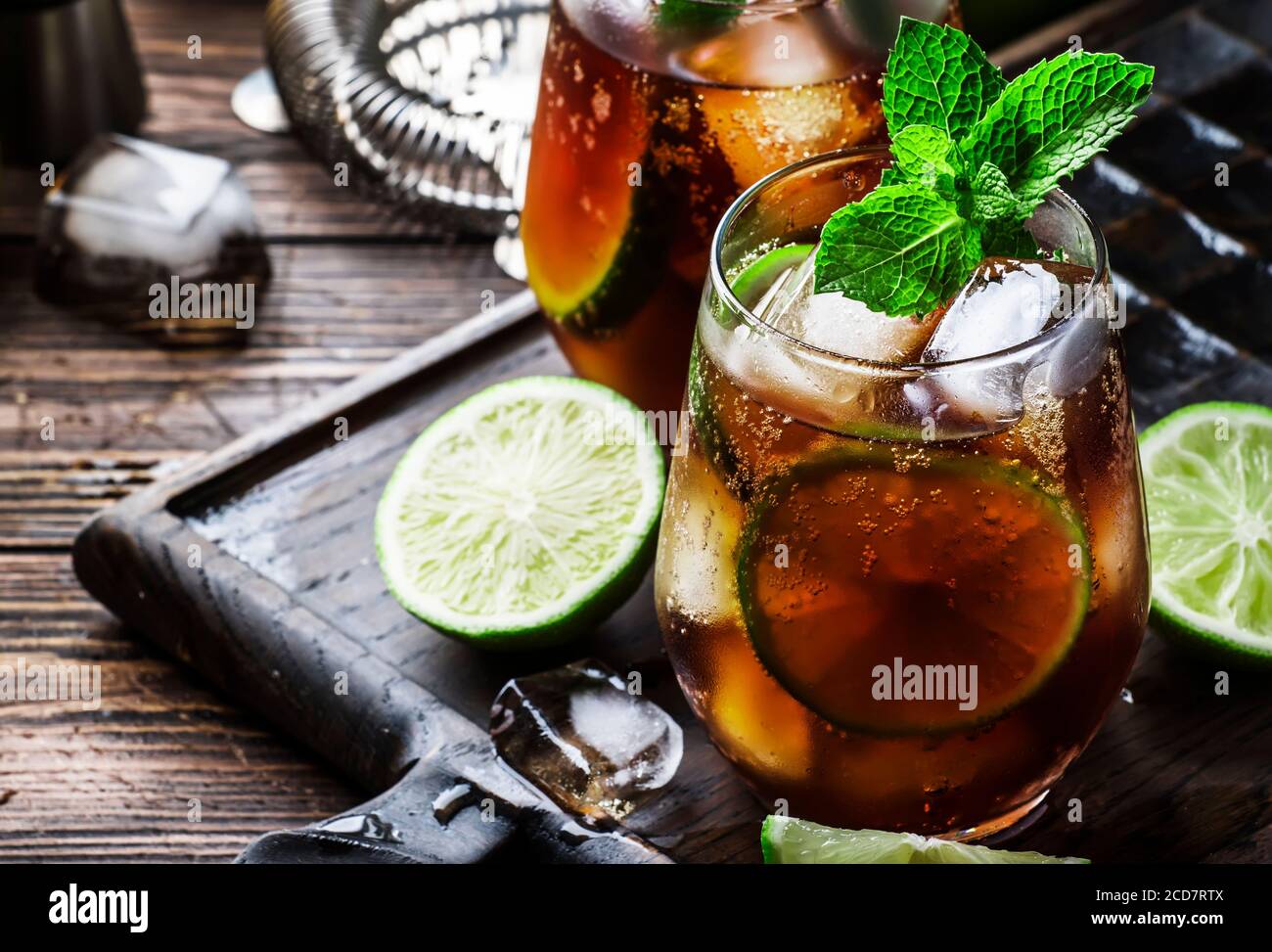 Cuba libre alcohol cocktail with golden rum, lemon juice, cola, lime ...