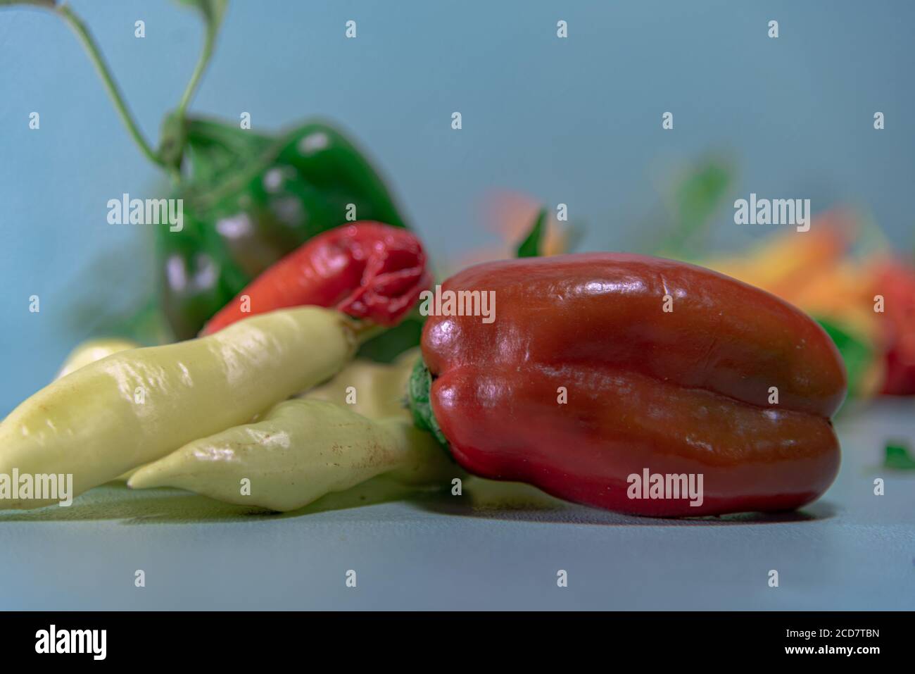 Brazilian peppers. vegetables on the blue background. Condiments and ...