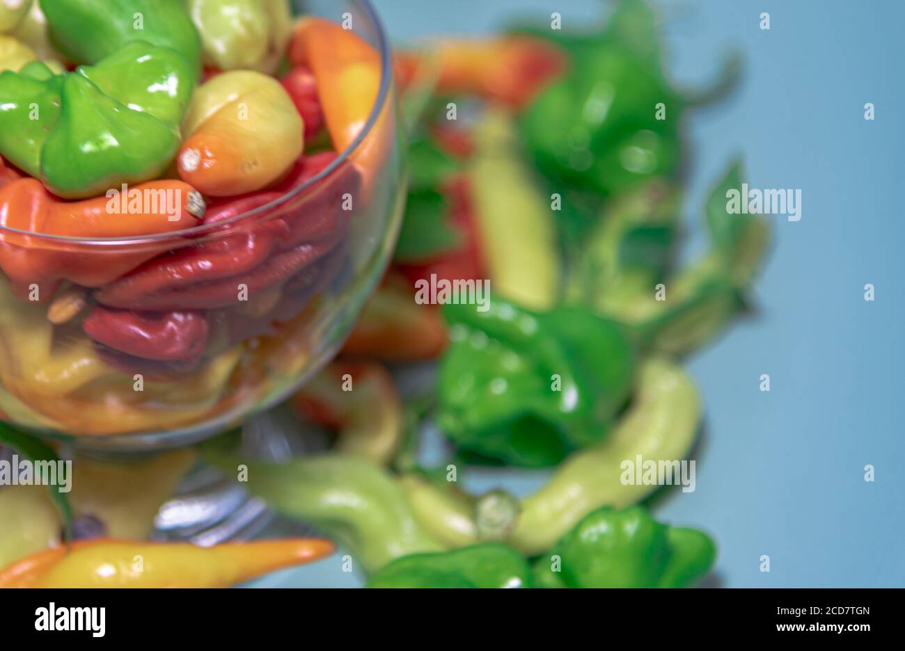 Brazilian peppers. vegetables on the blue background. Condiments and ...