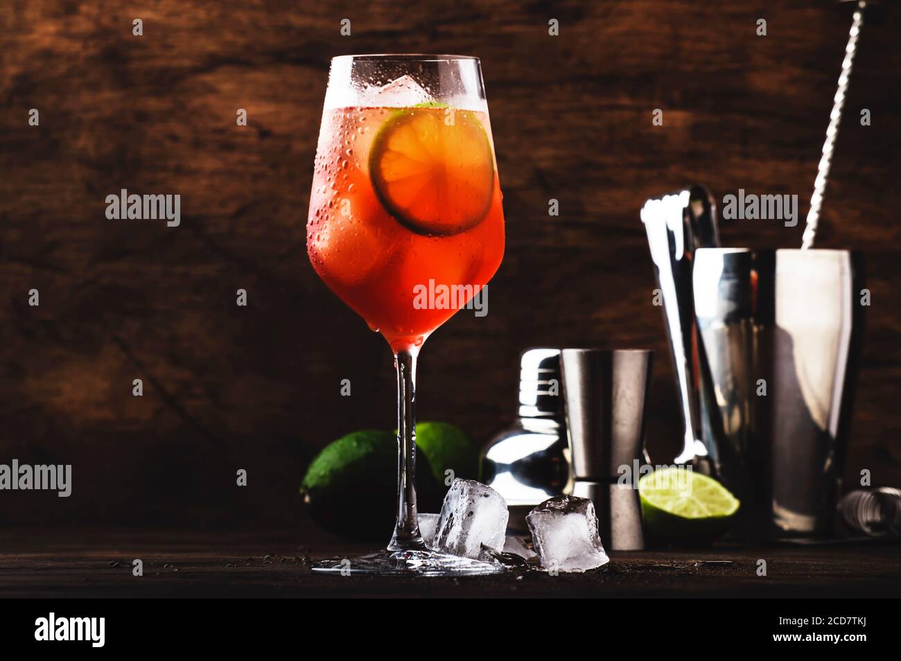 Campari tonic alcoholic cocktail with red bitter, tonic, lime and ice ...