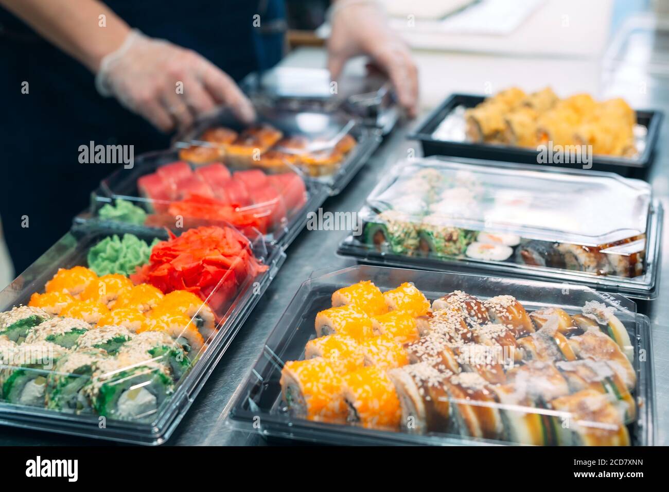 Sushi delivery. Many varieties of Sushi in a plastic box are prepared ...