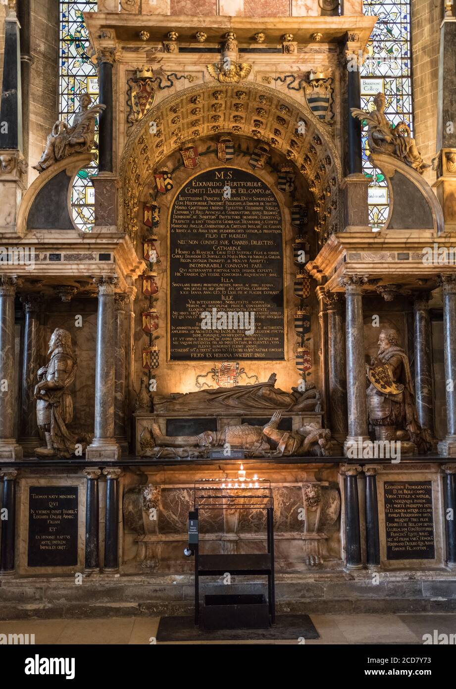 Ornate tomb and memorial inside Salisbury Cathedral with stained glass ...