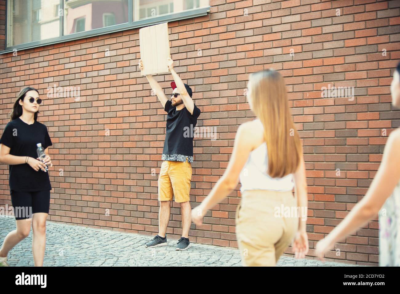 Dude with sign - man stands protesting things that annoy him. Solo ...