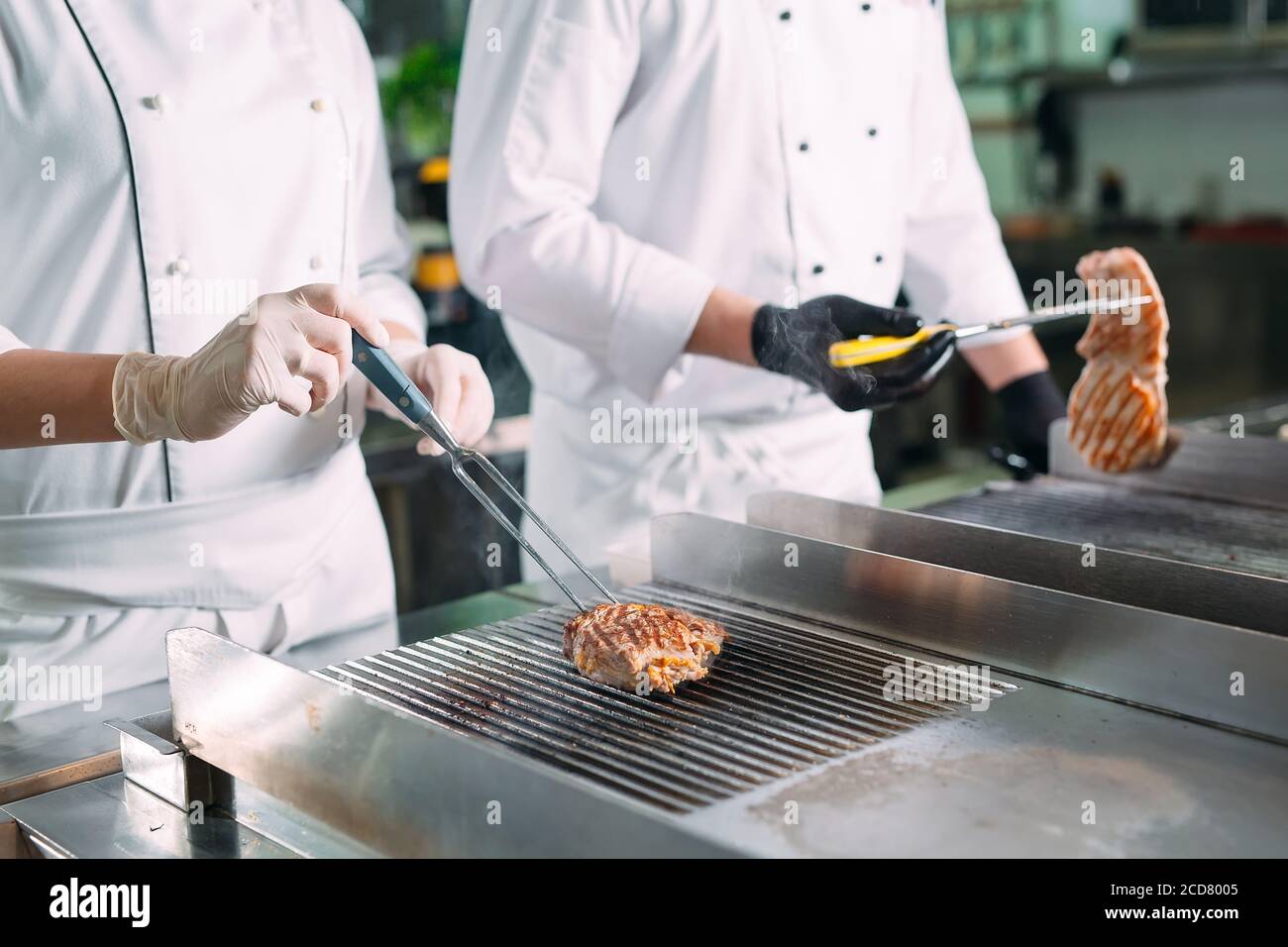 Apron man cooks on grill hi-res stock photography and images - Alamy