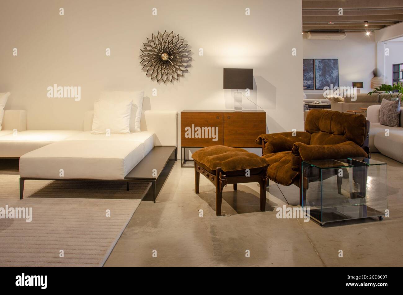 neutral tone living room with white sofa Stock Photo - Alamy