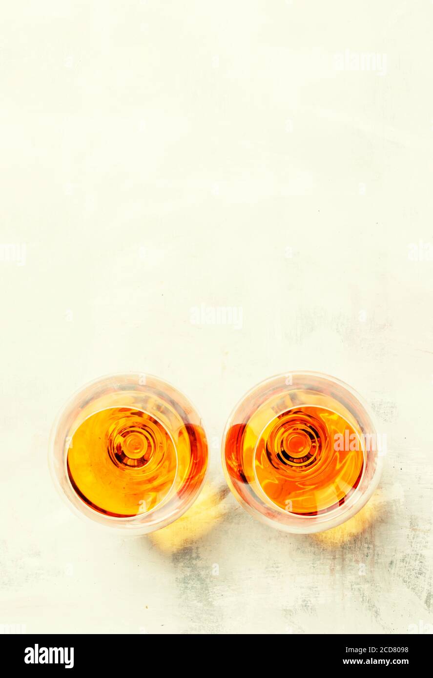 Two golden alcoholic drinks in a glasses, top view Stock Photo - Alamy