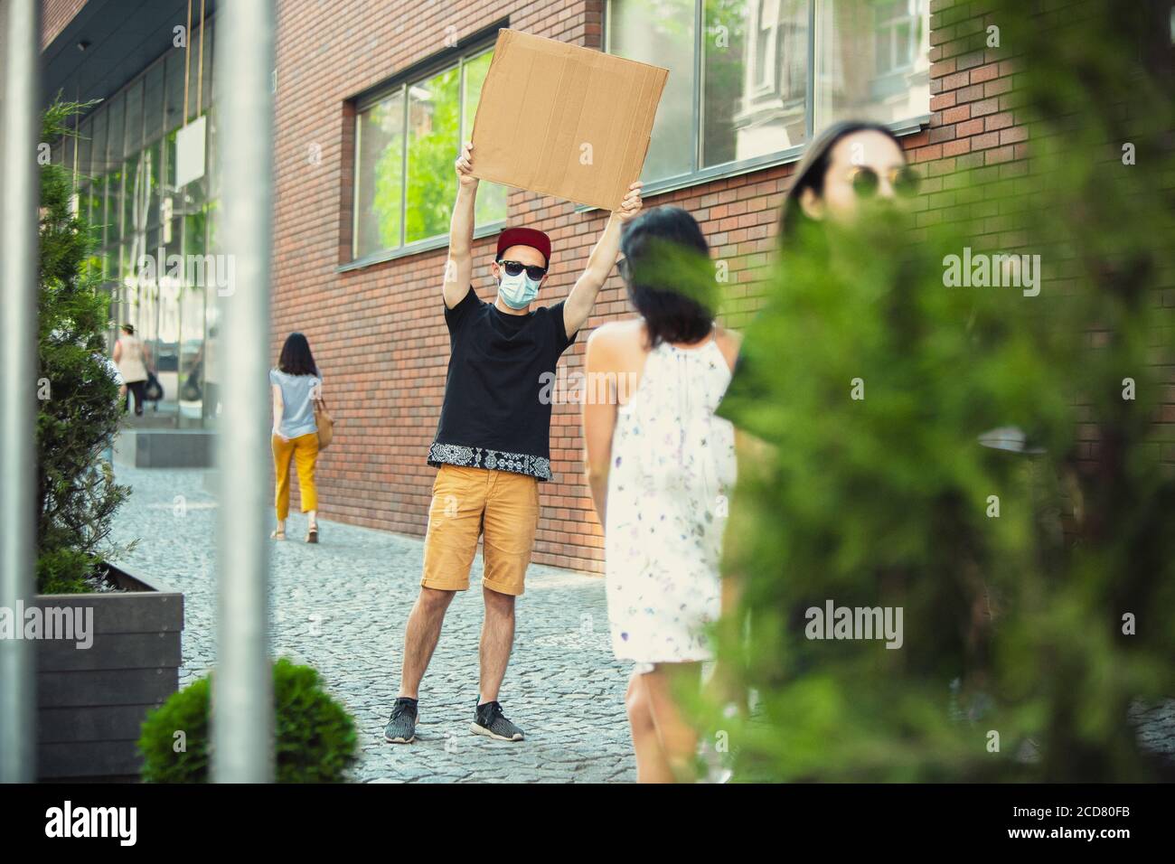Dude with sign - man stands protesting things that annoy him. Solo ...