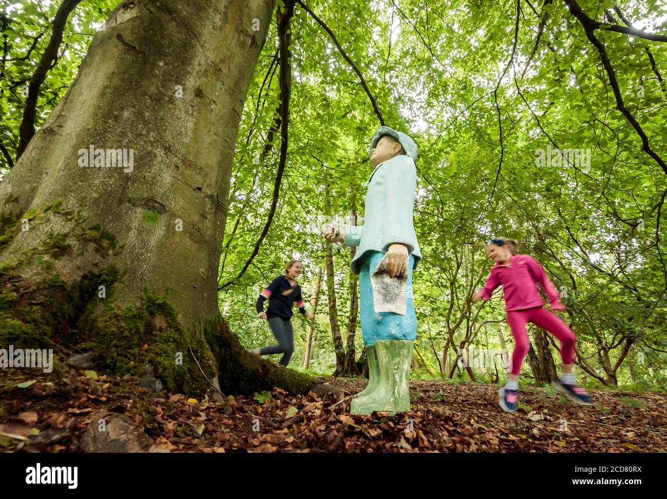 Sister Martha and Megan Machray play near an installation titled 'Paper ...
