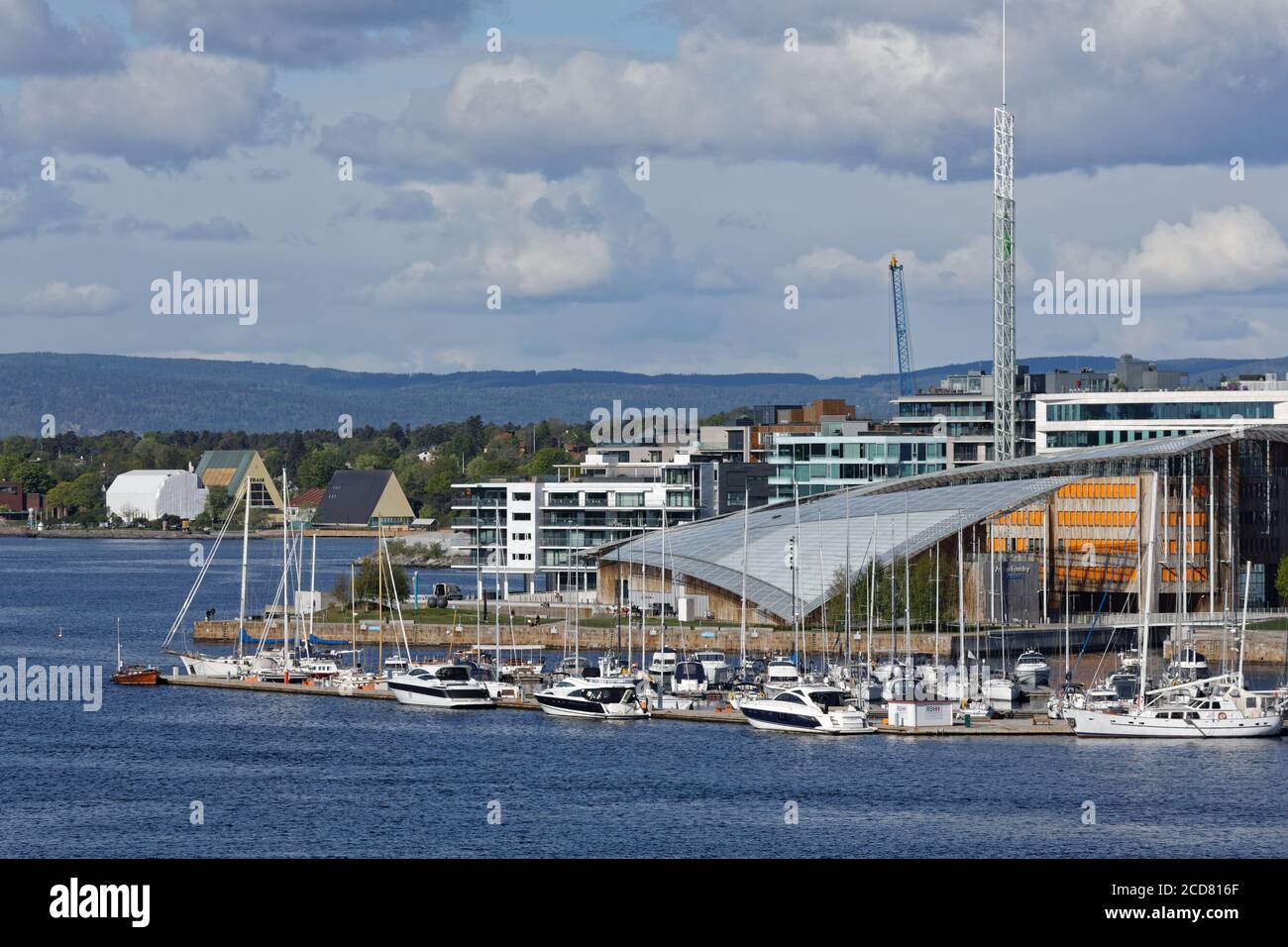 Aker brygge marina against Astrup Fearnley Museum of Modern Art in Oslo ...