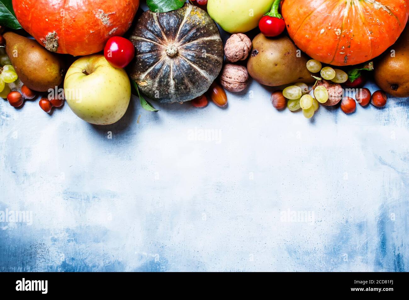 Fall food background with pumpkins, vegetables, fruits and nuts ...