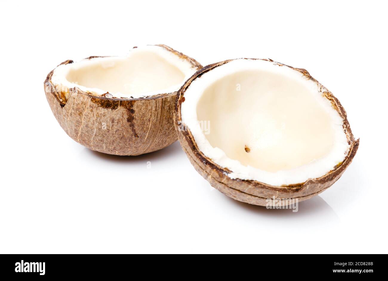 Coconut cut in half on white background Stock Photo - Alamy