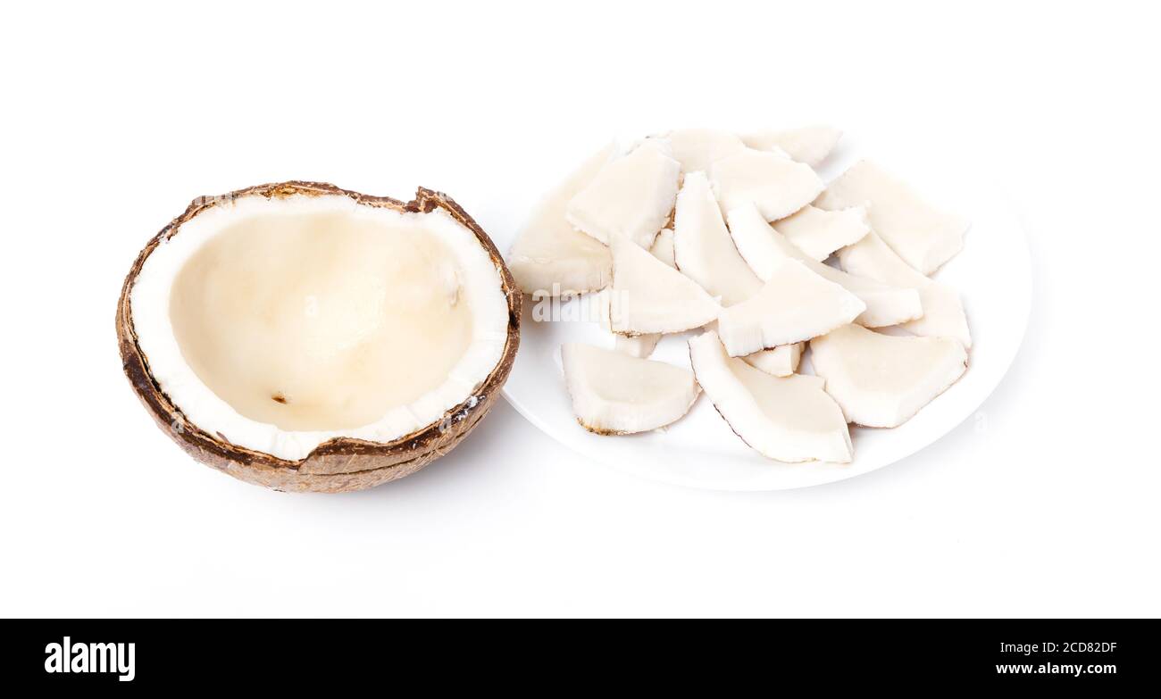 Coconut cut in half on white background Stock Photo - Alamy