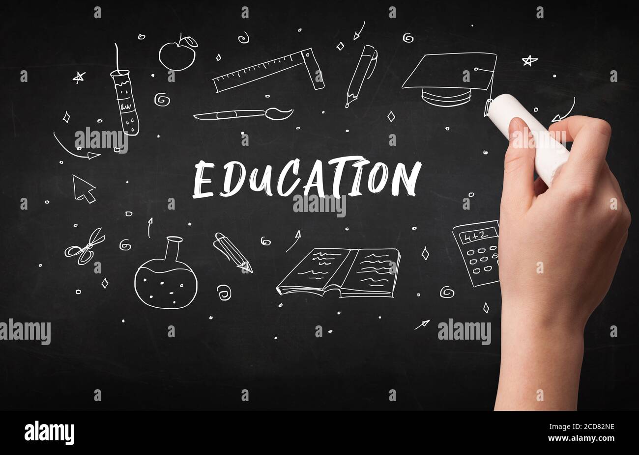 Hand drawing EDUCATION inscription with white chalk on blackboard ...