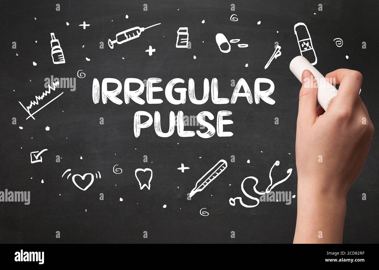 Hand drawing IRREGULAR PULSE inscription with white chalk on blackboard ...