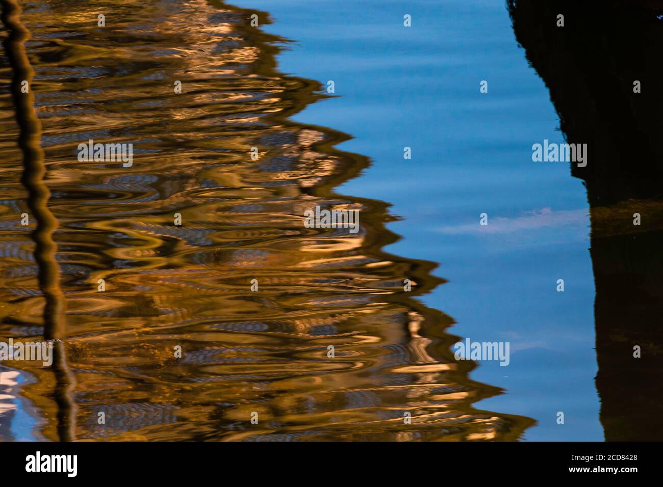 Shimmer of reflections in the ocean at sunset Stock Photo - Alamy