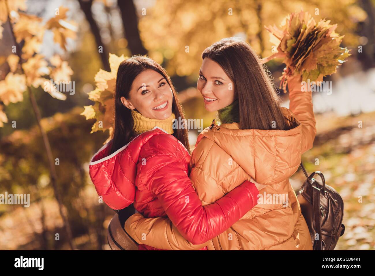 Back rear spine view photo of positive cheerful forever friends girls ...