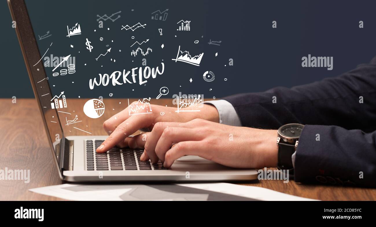 Businessman working on laptop with WORKFLOW inscription, modern ...