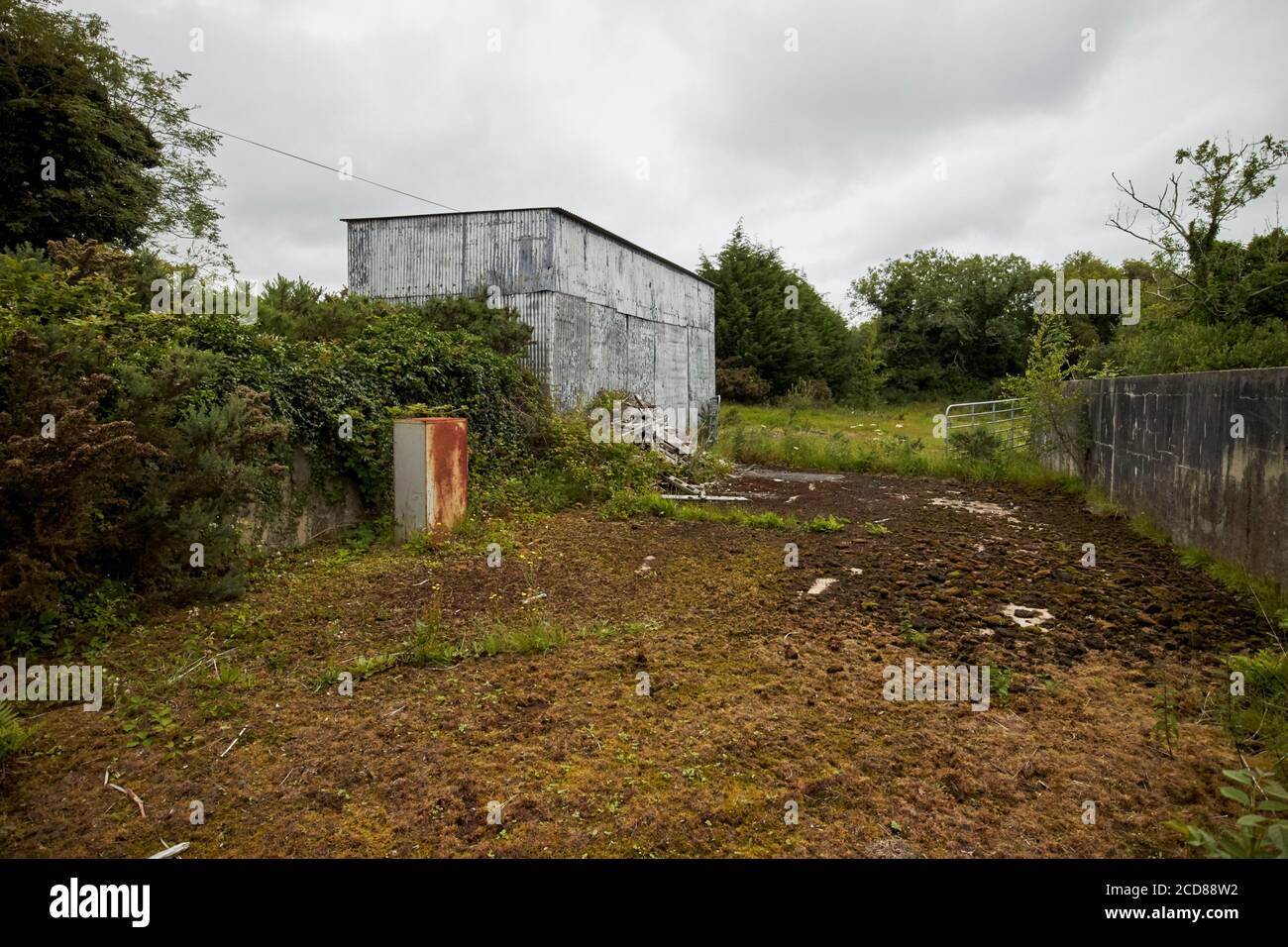 disused open clamp sileage silo on overgrown farmland in northern ...