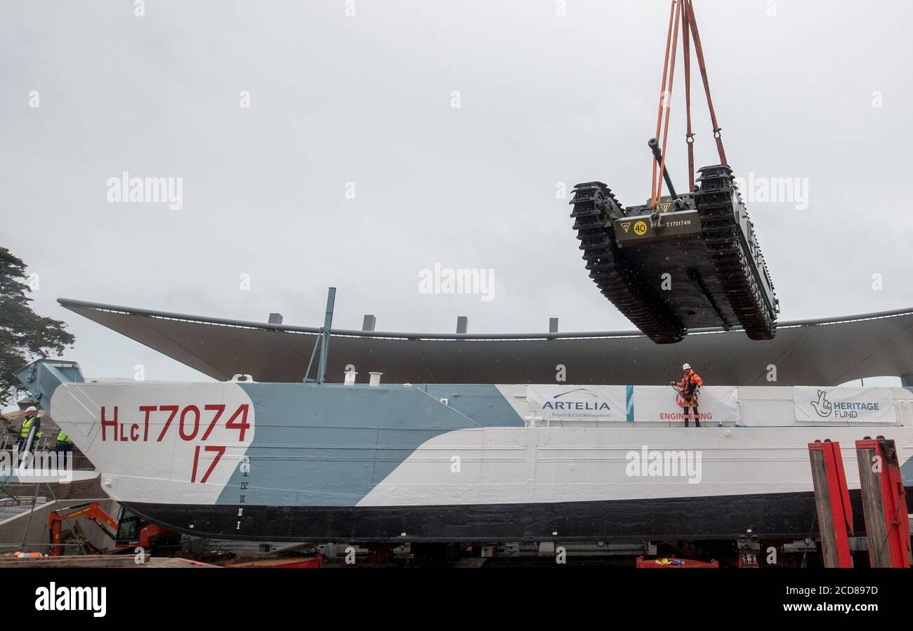 A Churchill Crocodile tank is craned onto the restored World War Two ...