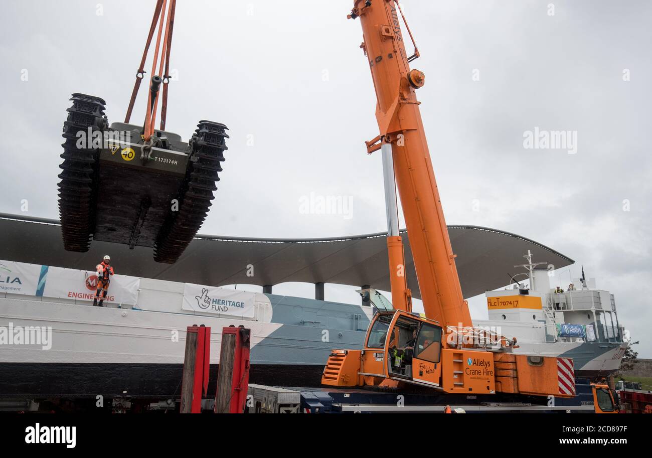 A Churchill Crocodile tank is craned onto the restored World War Two ...